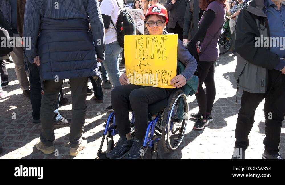 Boy picketing with picket sign, activist at Friday for future, Milan ...