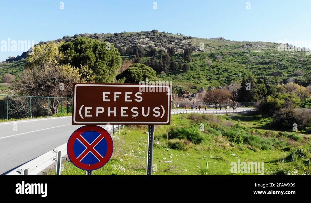 4K hd drone dolly sideways shot, in front of Ephesus sign, athletes ...