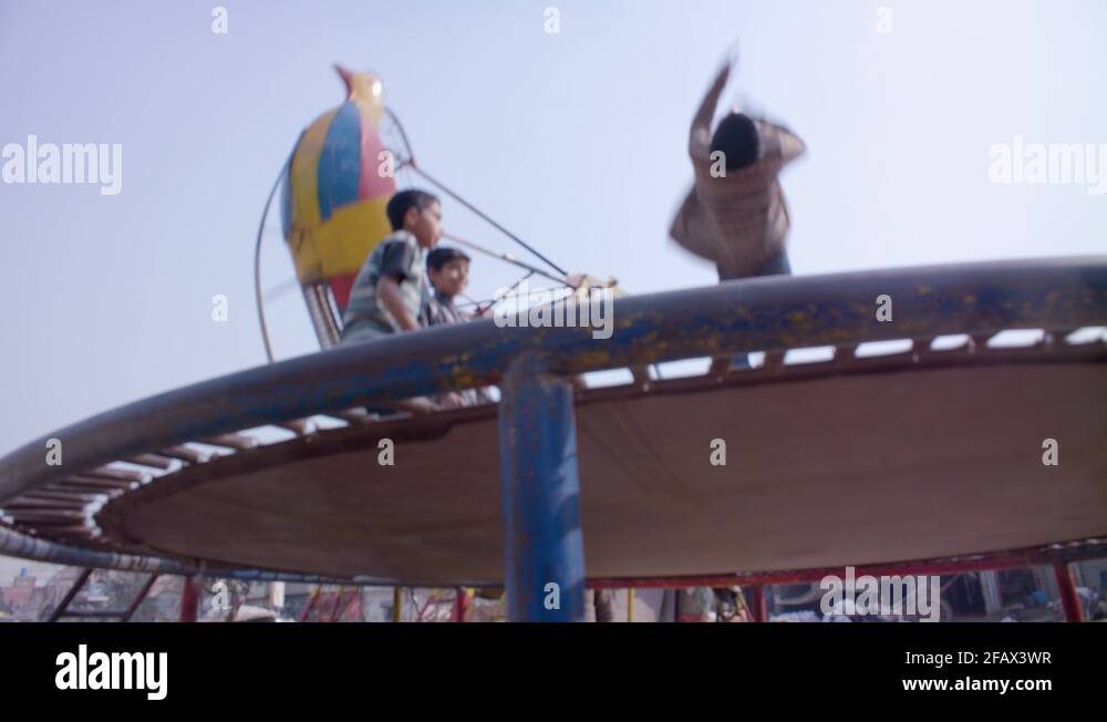 Local poor kids jumping and having fun on trampoline with a pirate ...