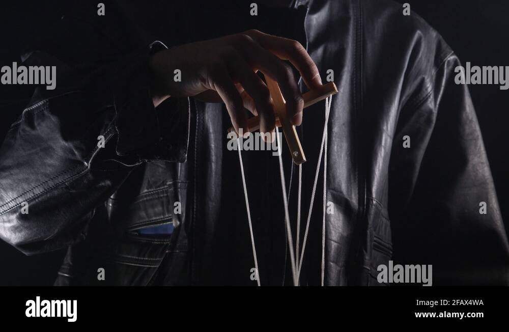 Pulling the strings Stock Videos & Footage - HD and 4K Video Clips - Alamy