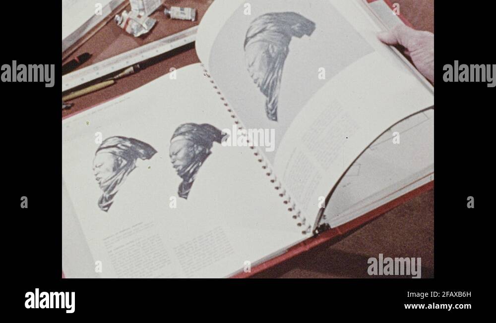 1970s: Hand flips through book. Hands put tracing paper over image. Man ...