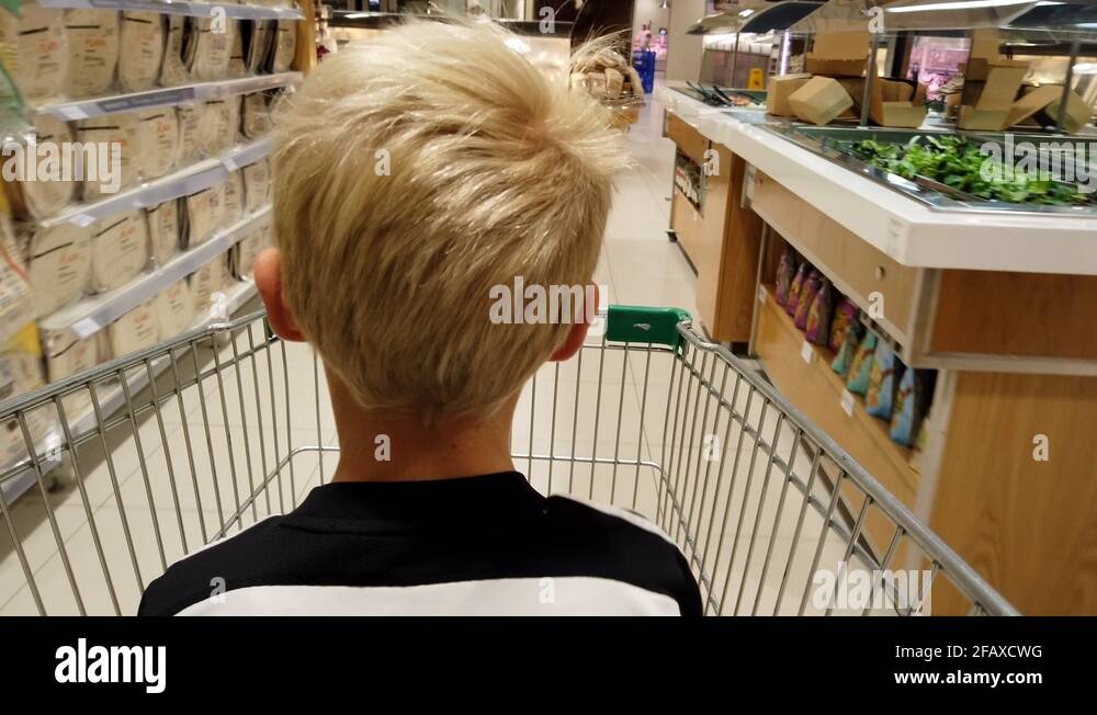 Kid in shopping cart Stock Videos & Footage - HD and 4K Video Clips - Alamy