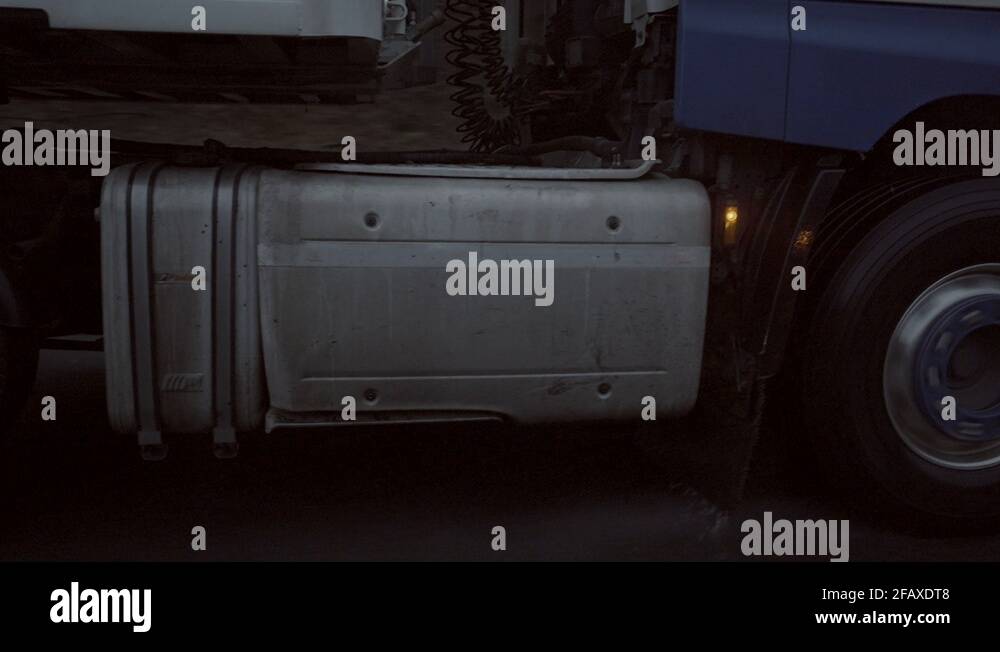Close up of lorry wheels and tyres on the highway in heavy rain and bad ...
