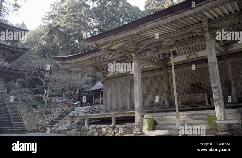 Very old Japanese temple and wooden tower with beautiful sunbeam in ...