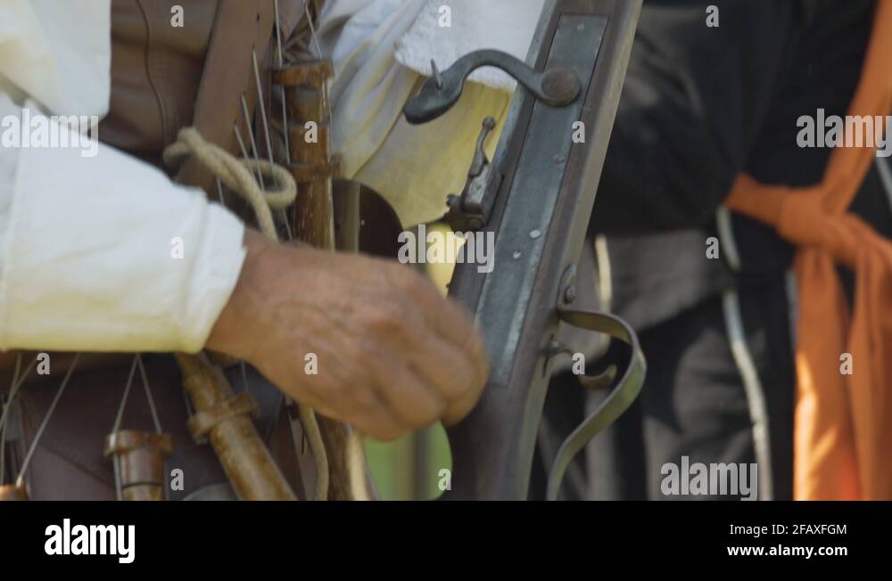 Preparing and loading an old Gun Musket. Reenactment. Close up Stock ...