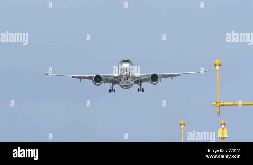 airplane qatar airways airbus a350 approach front view passing overhead ...