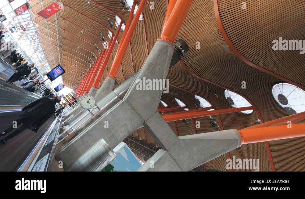 Riding an express walkway in modern airport terminal building, unique ...