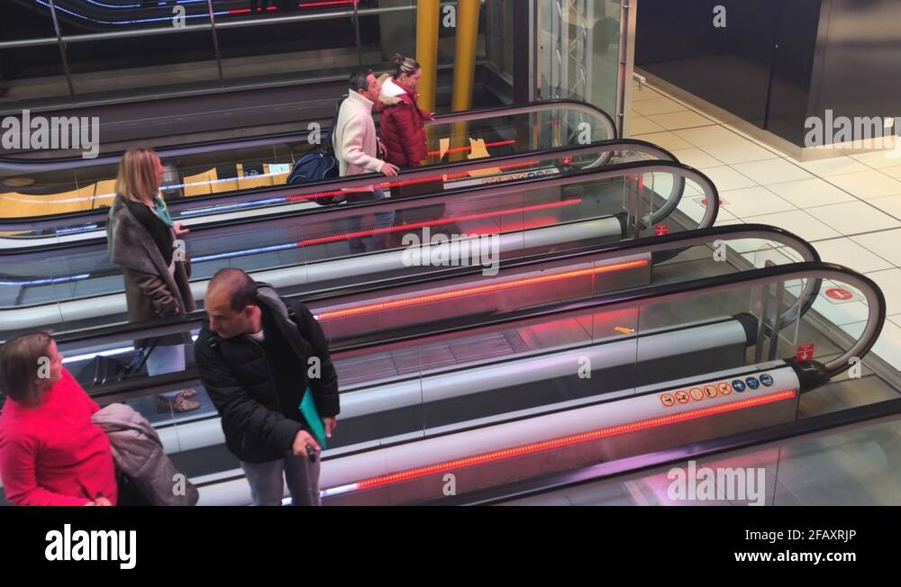Two row escalator stair with people, parallel escalator staircase ...