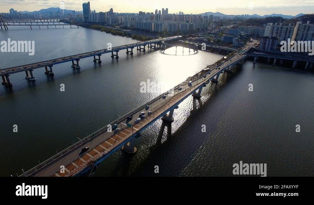 Korea, Seoul Han river front, car passing over bridge Stock Video ...