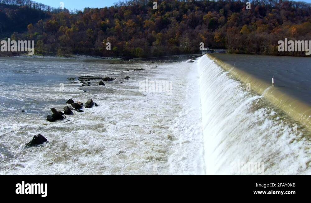 Hydraulic engineering on river, dam with spillway regulates the natural ...