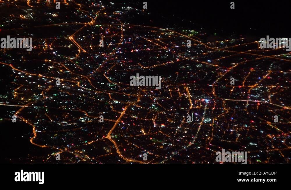 Night city. Multicolored street lights. Top view from the window of the ...