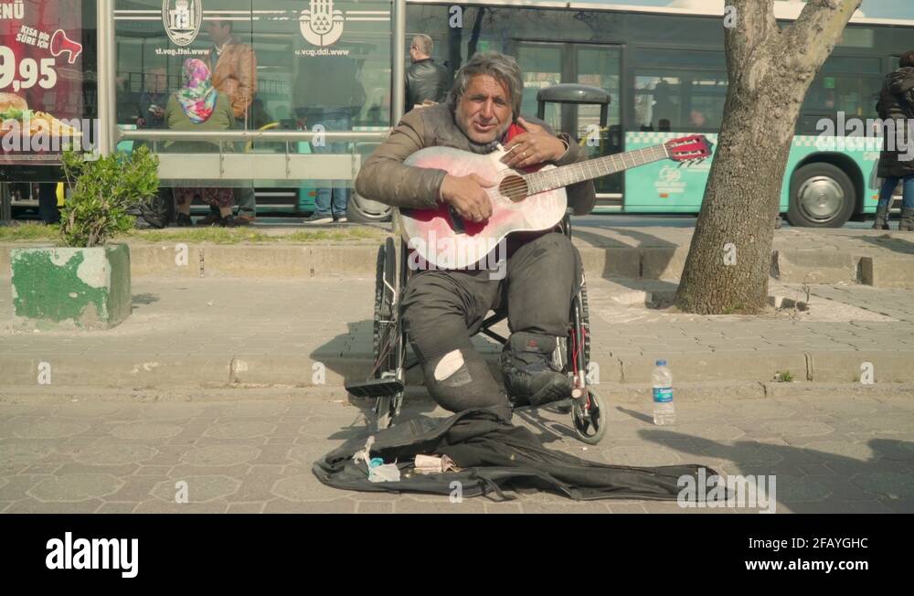 Busker wheelchair Stock Videos & Footage - HD and 4K Video Clips - Alamy
