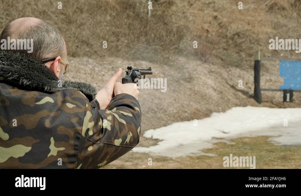 A man shooting a .357 magnum revolver outdoors. 4K Slow Motion Stock ...