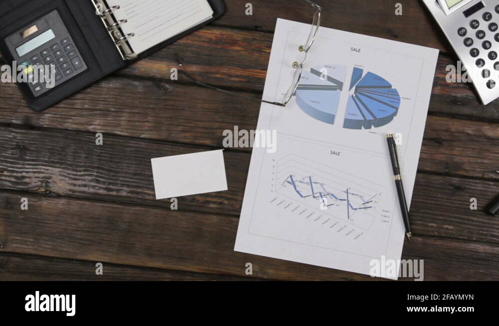 Crane lift, top view modern wooden desk work table with chart and pen ...