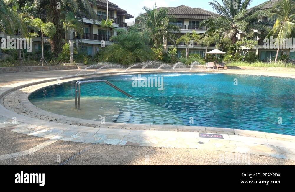 Luxurious rich circular hotel resort swimming pool stair ripples, wide ...