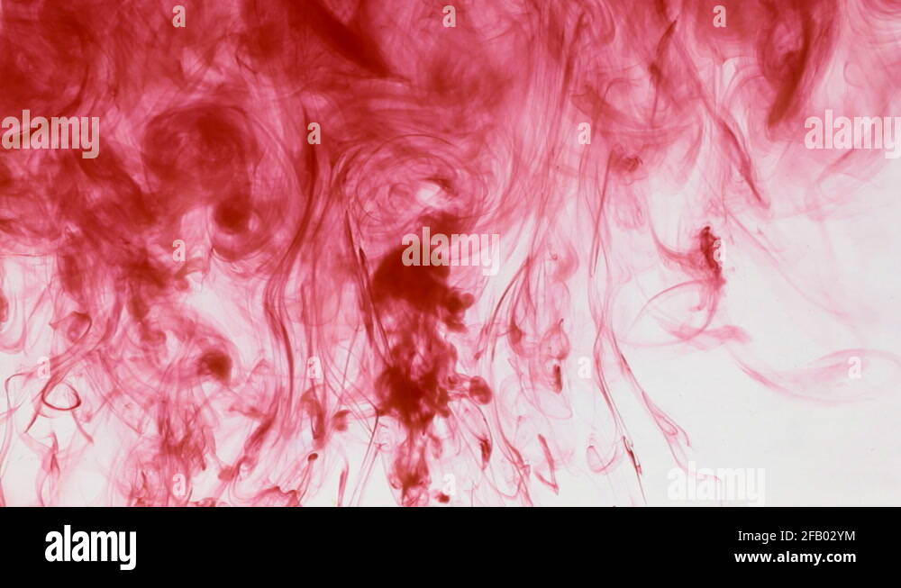 Many paint streams in water, red colored ink Stock Video Footage - Alamy