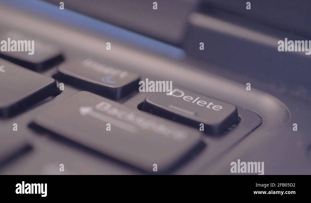 Pressing delete key on a laptop Stock Video Footage - Alamy