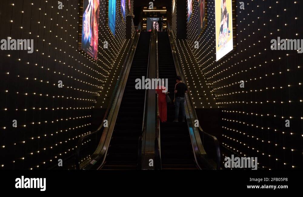 2 people going up a Fancy escalator in a cinema in Icon Siam Mega ...