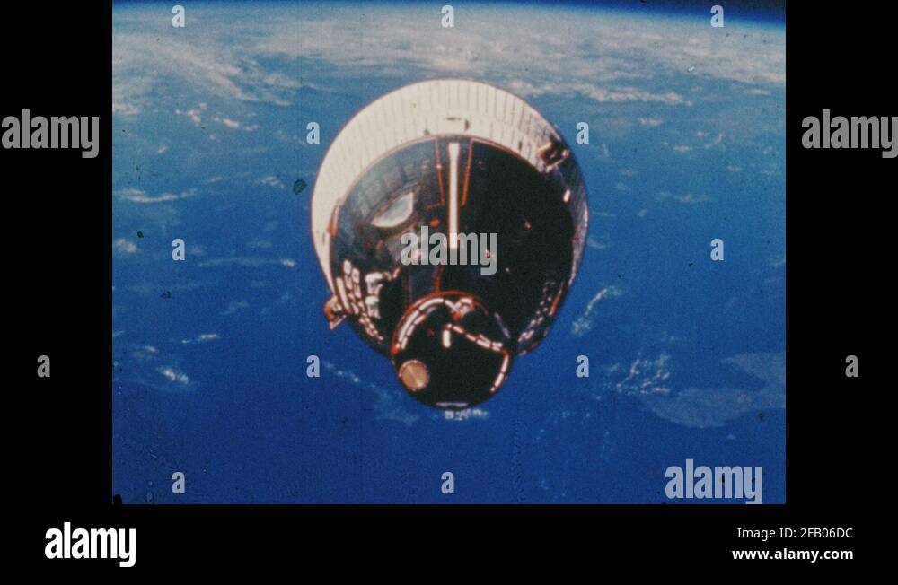 1960s: Rocket capsule in space. Rocket capsule in space above Earth ...