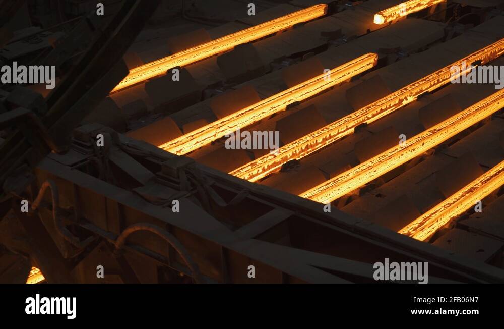 Steelmaking, steel bars and pipe production, red-hot pipes transported ...