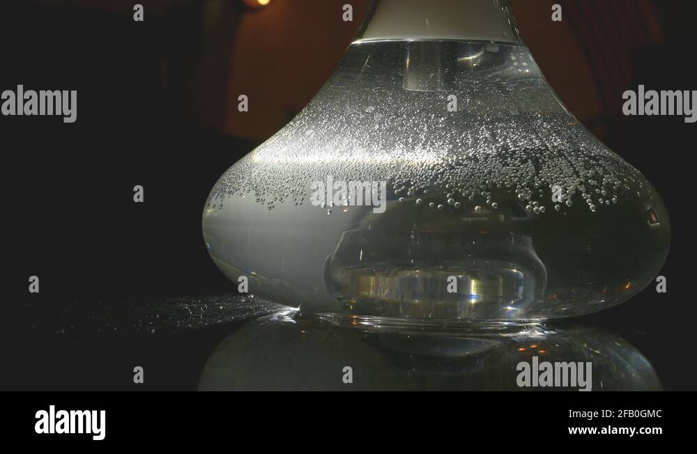 transparent hookah base filled with water, smoke and air bubbles ...