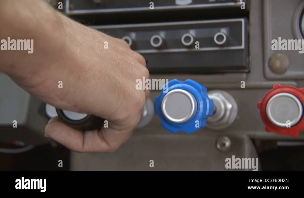 Pilot Works Instrument Panel Controls in Old Cessna 182 Airplane at ...