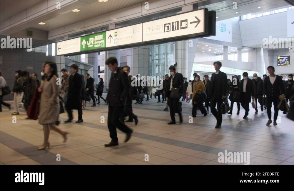 Commuter Crowd at Shinagawa Railway Station Stock Video Footage - Alamy