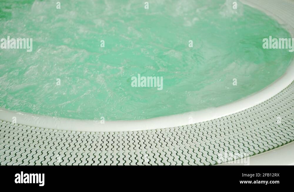 Hydromassage spa pool with bubbling turquoise water Stock Video Footage ...