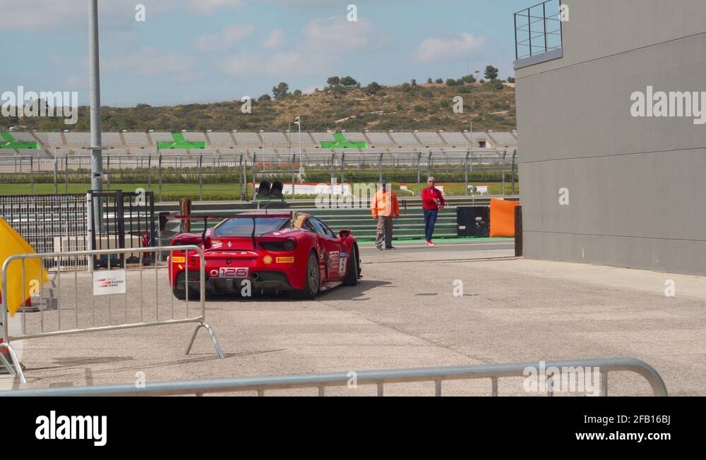 Tuned Red Ferrari 488 Challenge getting to the track. Racing car Stock ...