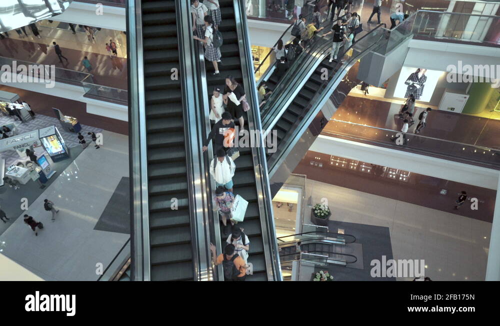Escalator 4k shopping mall crowd of people buy shop center Stock Video Footage - Alamy
