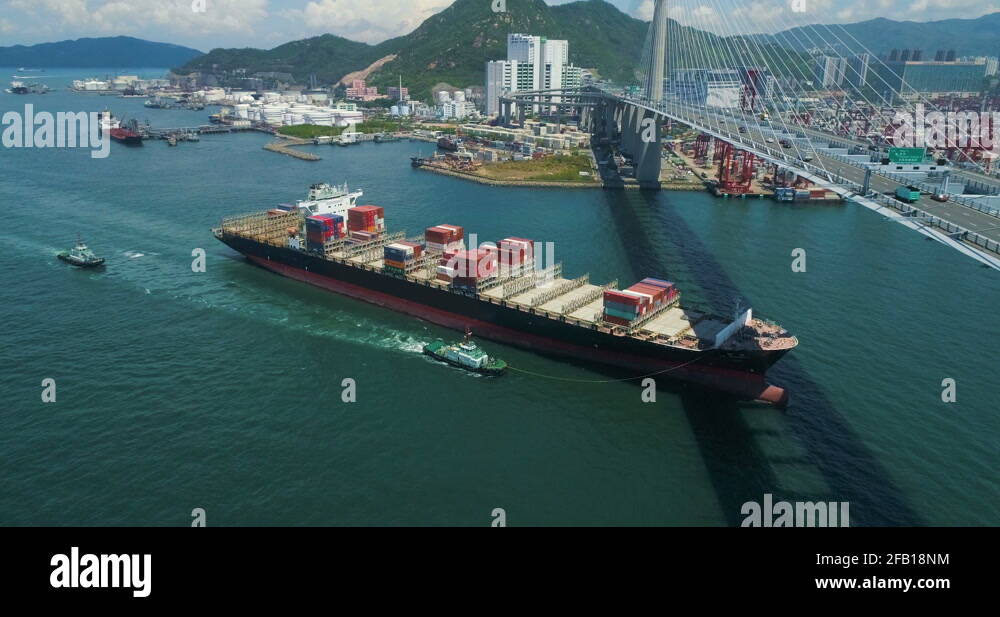 Cargo container ship entering the Hong Kong container terminal top view ...
