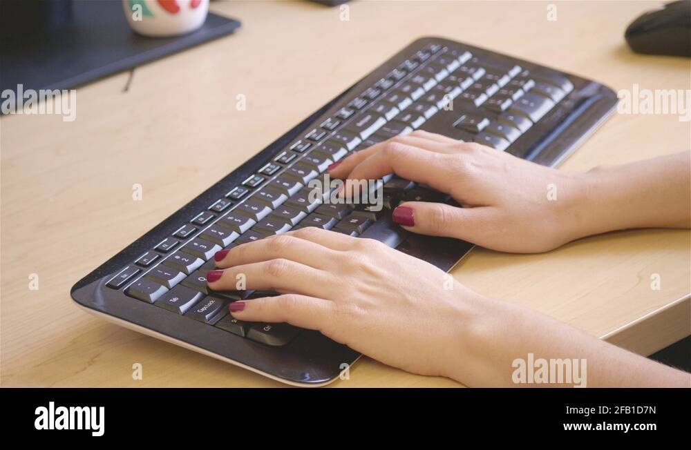 Hands with red nail polish typing on black keyboard Stock Video Footage ...