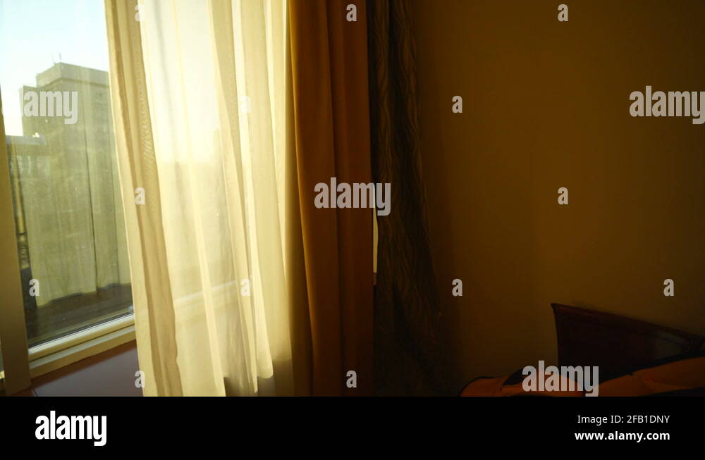 Upper floor hotel room or apartment window with morning city view Stock ...