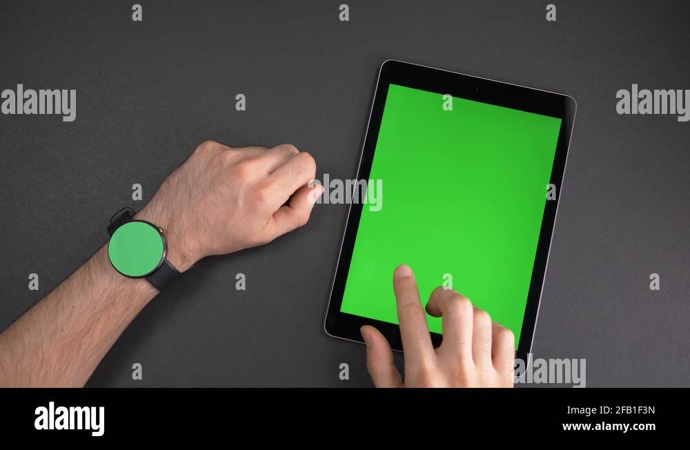 Using a Smartwatch and a Tablet With Green Screen Top View Stock Video ...