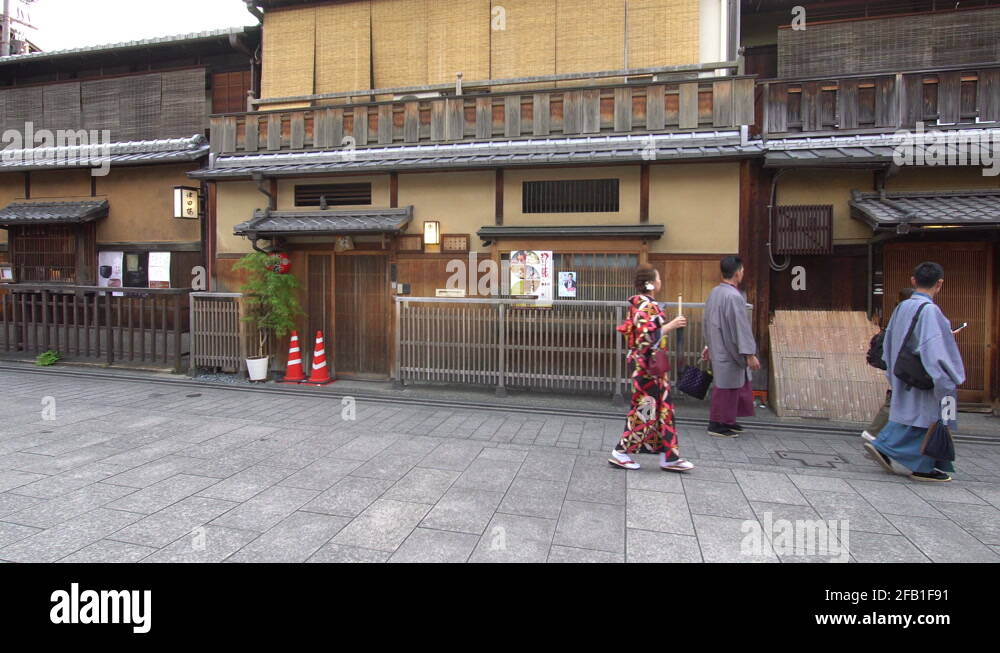 People on Hanami street in old quarter of geisha Gion in Kyoto Japan ...