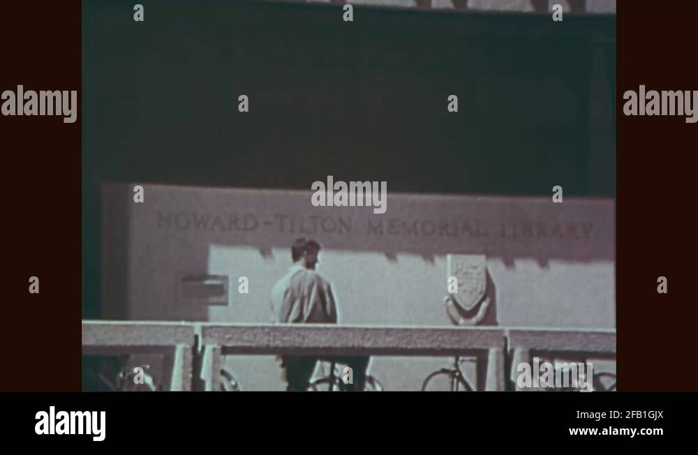 Exterior of Howard-Tilton Memorial Library and girl checks catalog tray ...