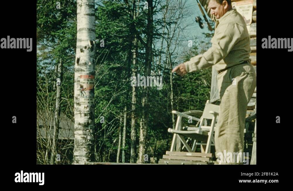 1950s: Man tests fishing rod from porch of cabin; man casts fishing ...
