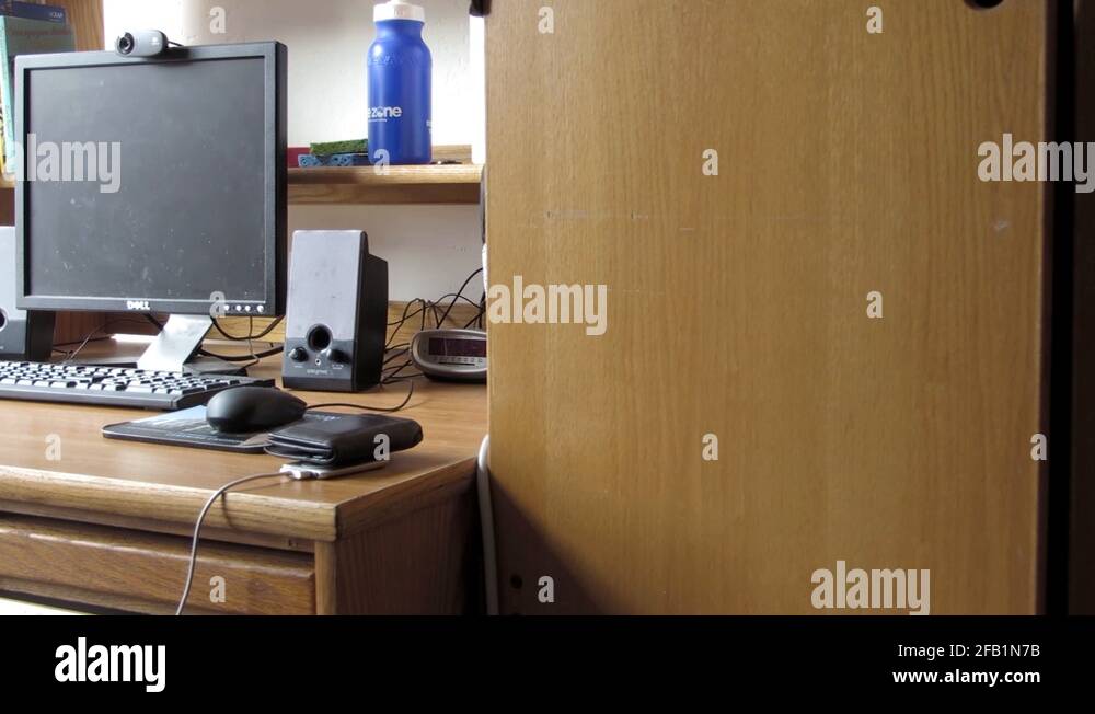 College boy student's dorm room computer study desk at university at UC ...