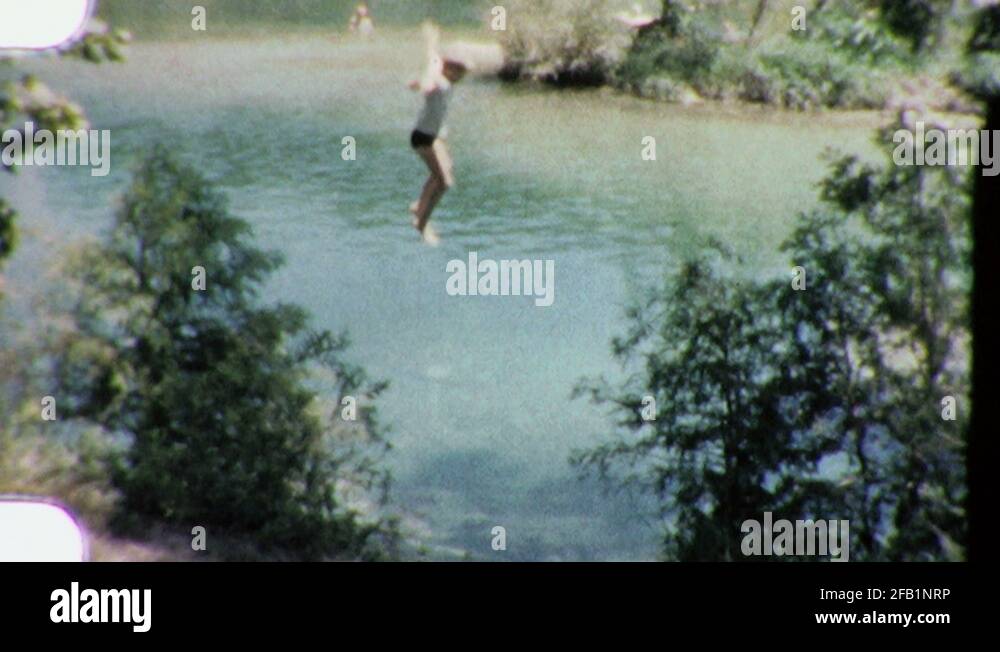 1960s Boy Jumping into SWIMMING HOLE Pool Lake Vintage Old Film Home ...