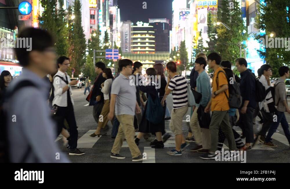 Side View - Japanese People Crossing Street at Night in Tokyo, Japan ...