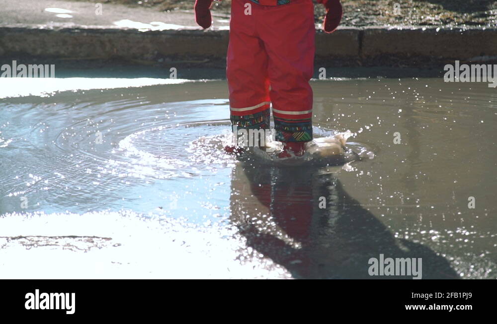 Splashing in a puddle Stock Videos & Footage - HD and 4K Video Clips ...