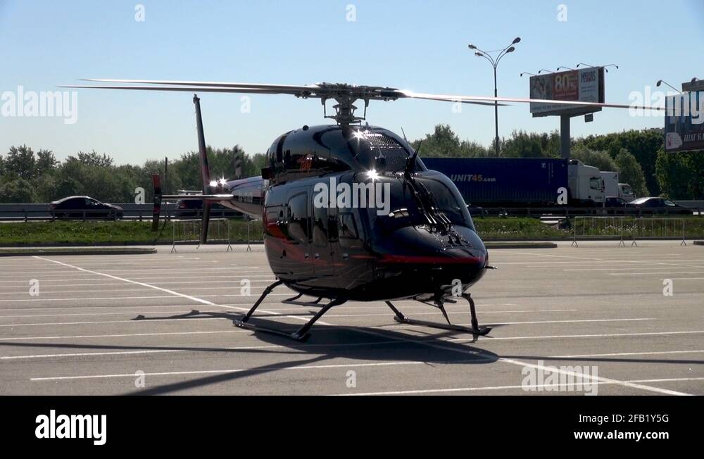 Bell 429 helicopter with rotating vanes against background Moscow Ring ...