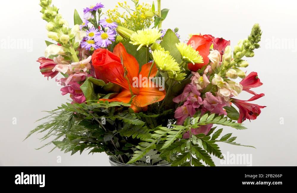 360 Degree Looping Rotation of Flower Bouquet above Vase, Center Screen ...