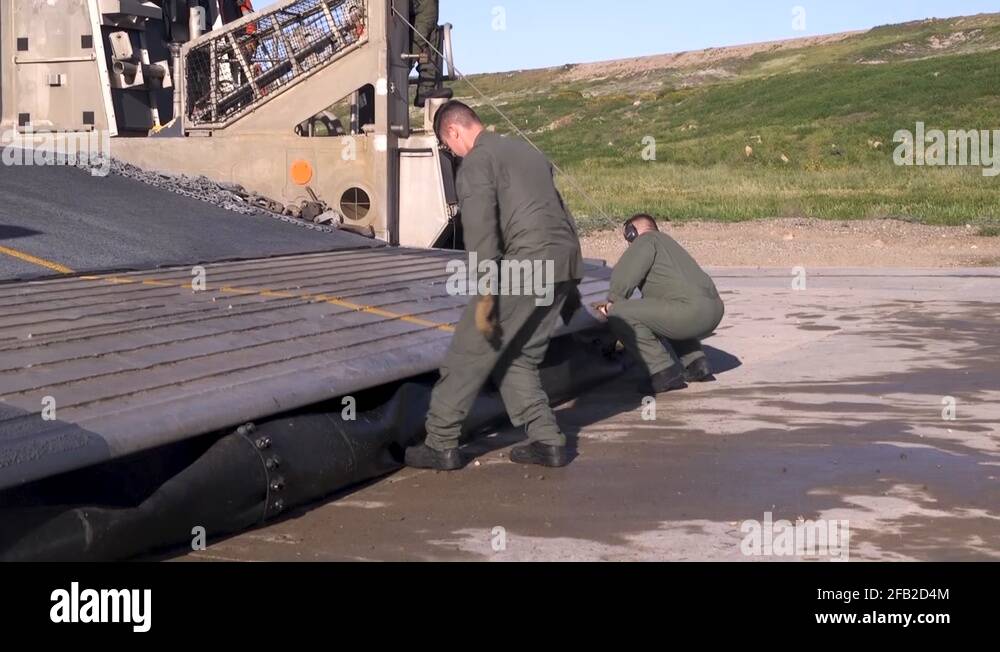 Bow ramp being lowered on landing craft air cushion Stock Video Footage ...