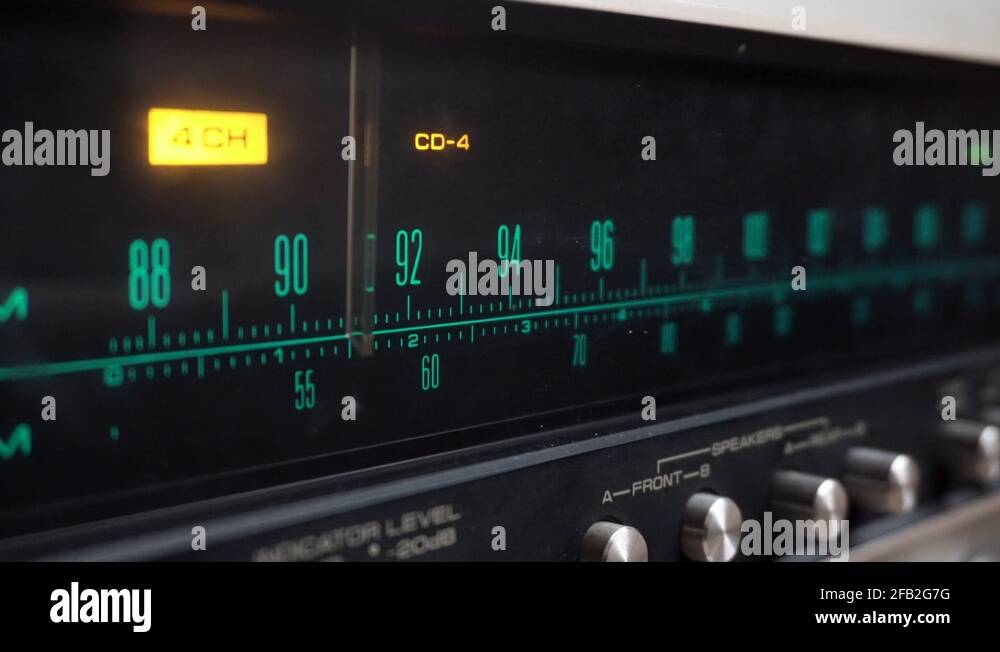 Tuning in an old and retro amplifier, with green FM numbers Stock Video ...