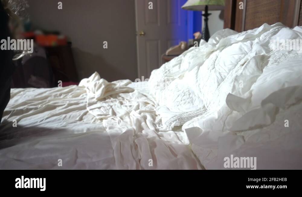Woman falling on bed Stock Videos & Footage - HD and 4K Video Clips - Alamy