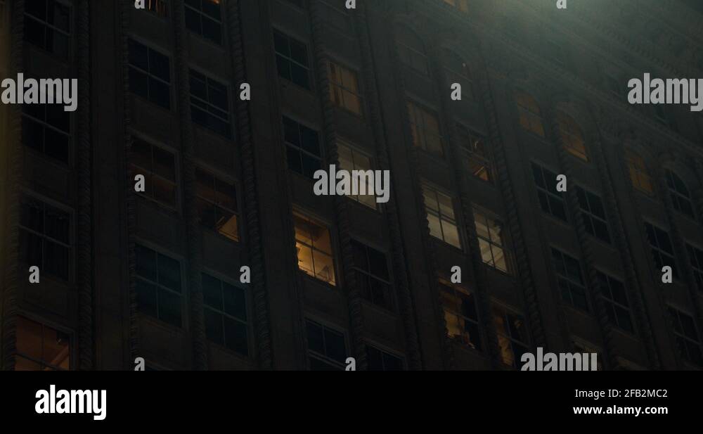 The side of a building looking in the windows at night, Wide Stock ...