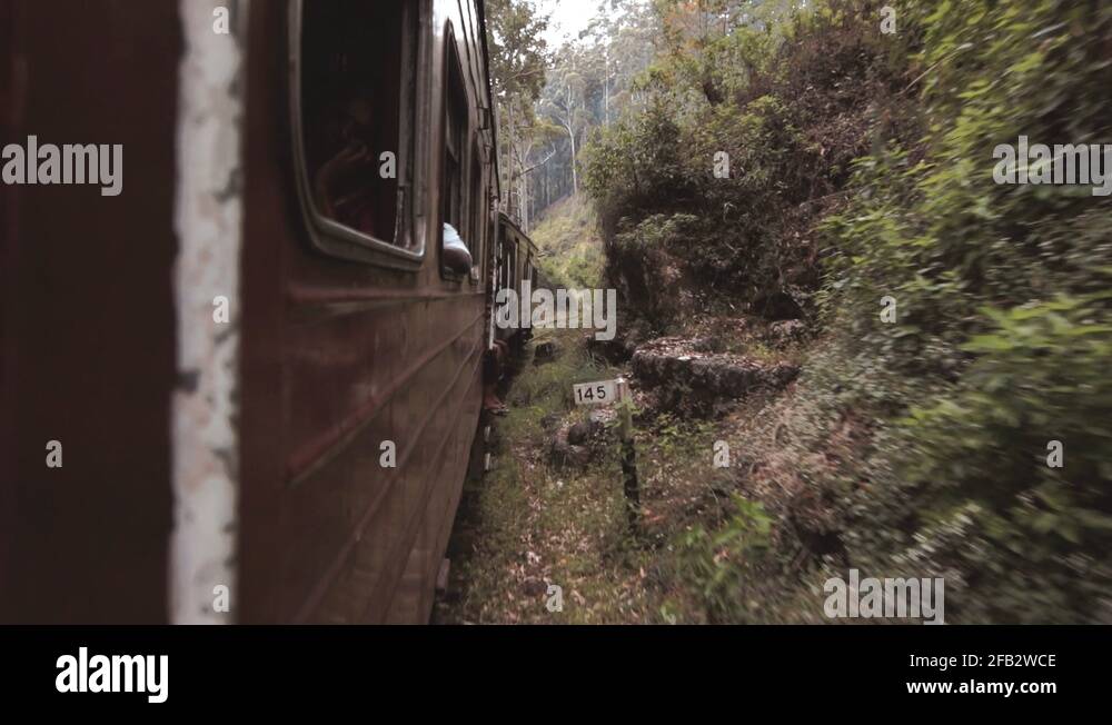 Traditional indian train driving at scenic mountain side Stock Video ...