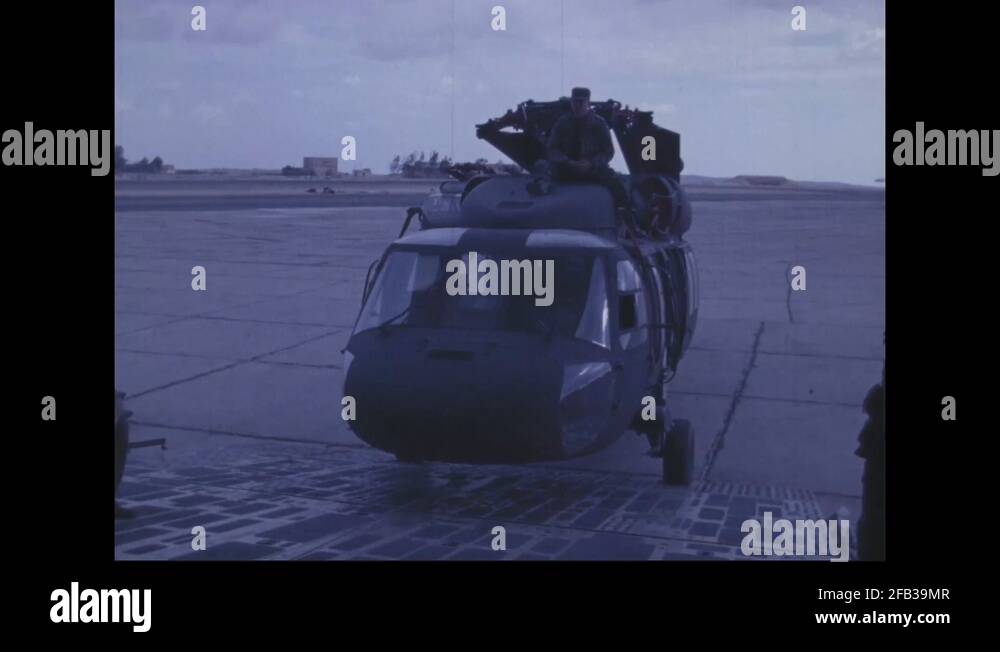 UH-60 Black Hawk helicopter being loaded into aircraft - 1980 Stock ...