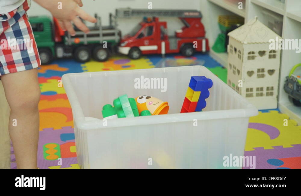 Boy cleaning up toys Stock Videos & Footage - HD and 4K Video Clips - Alamy